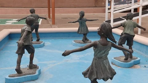 CHILDREN PLAYING SCULPTURE | Stock Video | Pond5