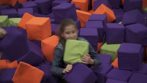 Children playing with soft cubes in game... | Stock Video | Pond5