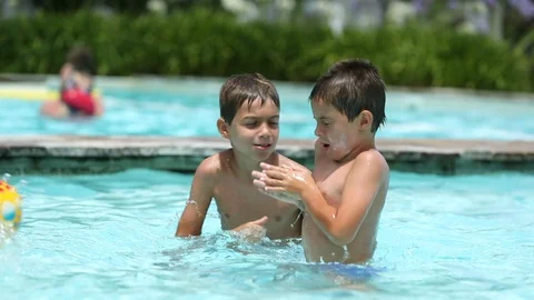 Children playing at the swimming pool. k... | Stock Video | Pond5
