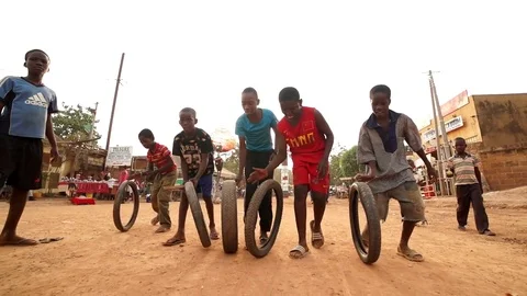 Children playing wheels Africa | Stock Video | Pond5