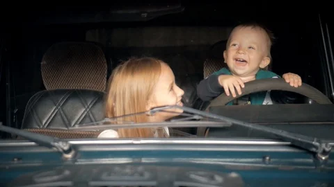 Children pretend driving car sitting on ... | Stock Video | Pond5