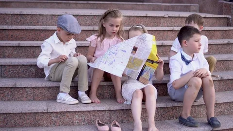 Children in a retro to clothes sit on bu... | Stock Video | Pond5