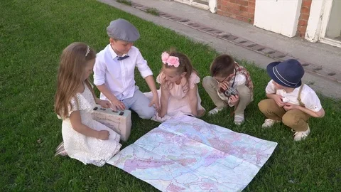 Children in a retro to clothes sit on a ... | Stock Video | Pond5