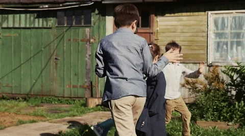 Children running around girl with tied s... | Stock Video | Pond5