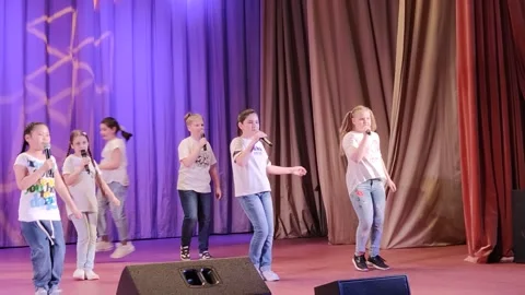 Children sing a song on stage at a festi... | Stock Video | Pond5