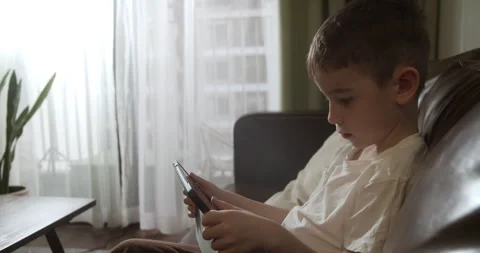 Children tech addiction concept. Cute pr... | Stock Video | Pond5