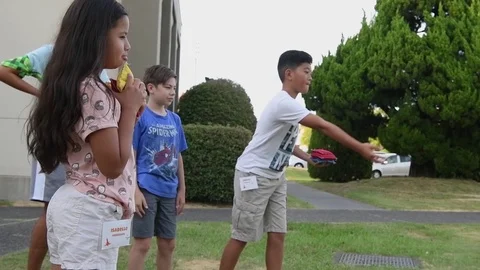 Children throwing beans bags at vacation... | Stock Video | Pond5