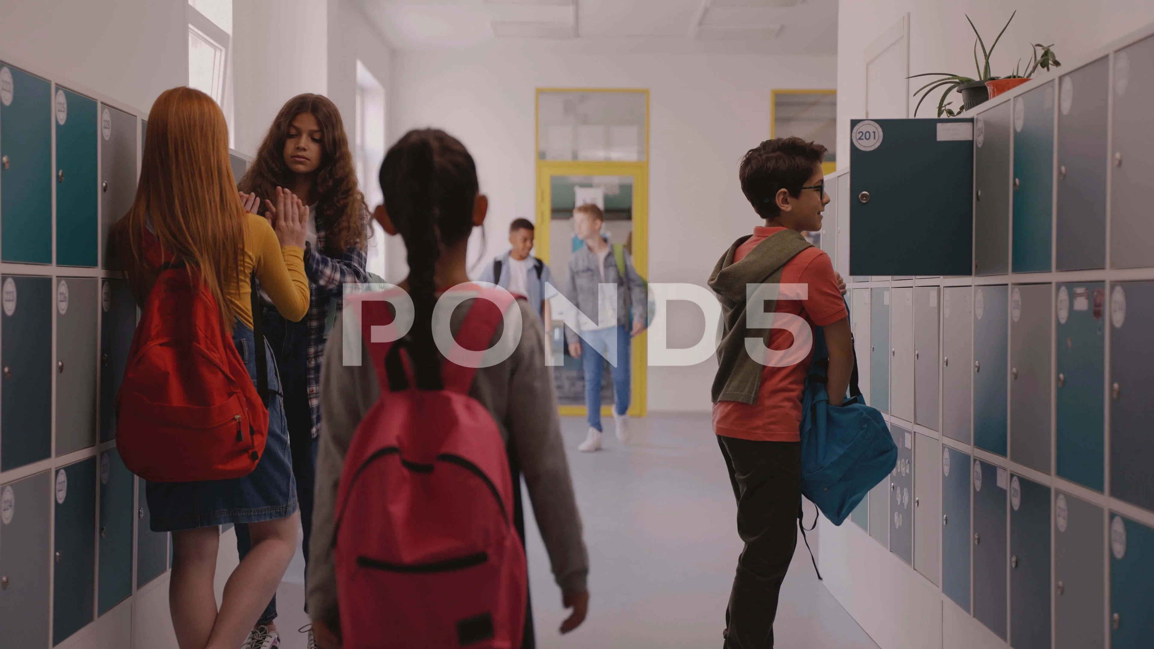 Kids Walking In School Hallway