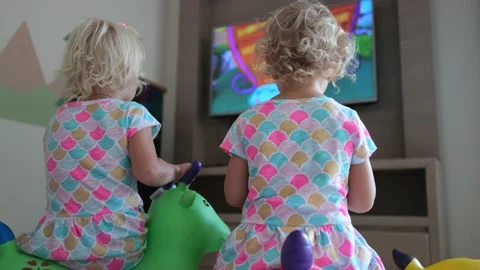 Children watch cartoons on TV in the pla... | Stock Video | Pond5
