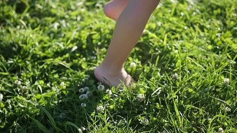 children's bare feet running through the... | Stock Video | Pond5