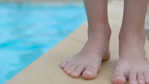 Children's feet along the pool. | Stock Video | Pond5