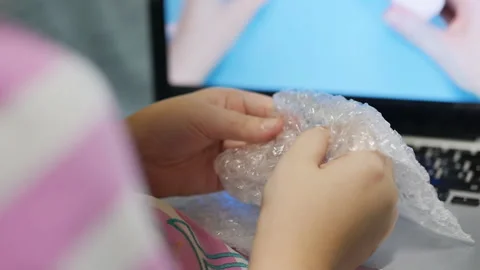 children's hands burst bubbles on the bu... | Stock Video | Pond5