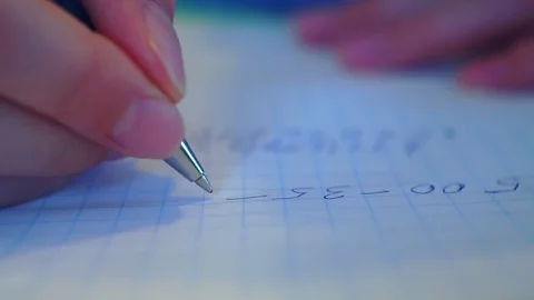 children's hands write numbers on a shee... | Stock Video | Pond5