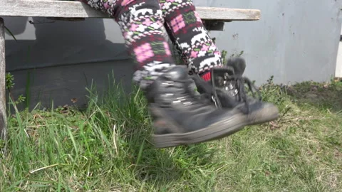 child's feet on the bench | Stock Video | Pond5