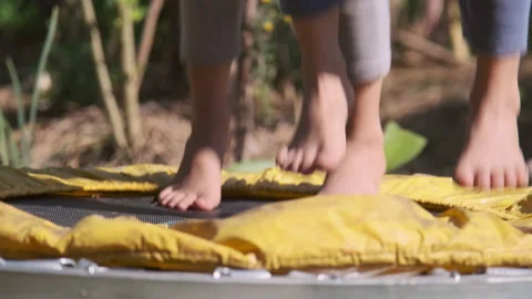 Child's feet jumping high while playing ... | Stock Video | Pond5