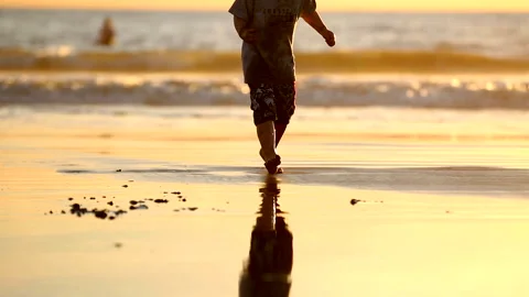 Child's legs and feet running along the ... | Stock Video | Pond5