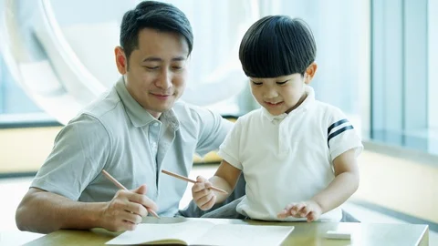 Chinese Asian father and son enjoying dr... | Stock Video | Pond5