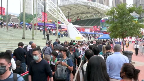Chinese attendees queue in line to enter... | Stock Video | Pond5