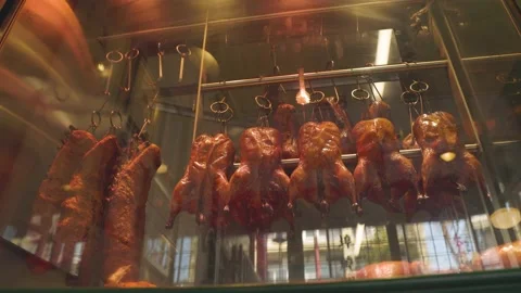 Chinese BBQ hanging in a display window,... | Stock Video | Pond5