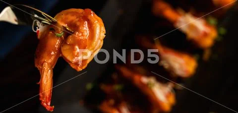 Photograph: Chinese food background of prawn stir fried with red sauce ...