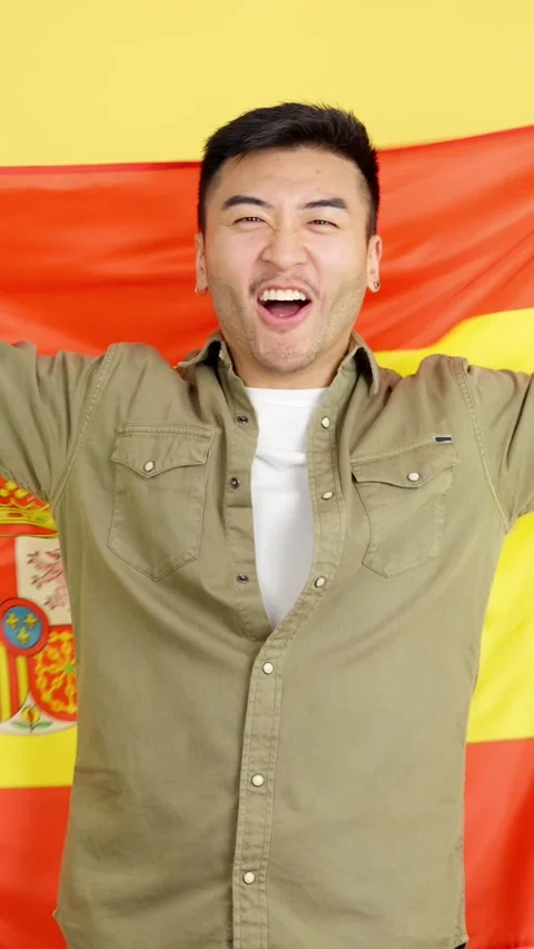 Chinese man smiling and raising a spanis... | Stock Video | Pond5