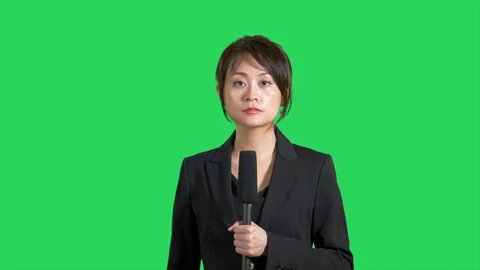 Chinese news reporter on green screen | Stock Video | Pond5