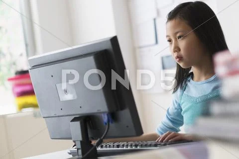 Photograph: Chinese student using desktop computer #50414067