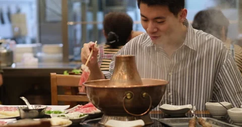 Chinese young man eating traditional Chi... | Stock Video | Pond5
