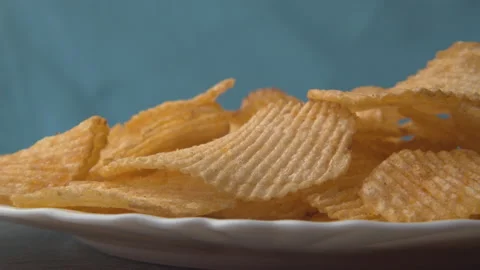 Potato Chips Falling Stock Footage ~ Royalty Free Stock Videos | Page 9