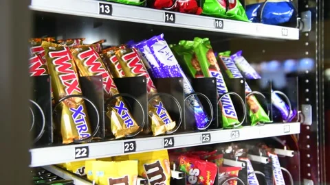 chocolate bars in snack vending machine | Stock Video | Pond5