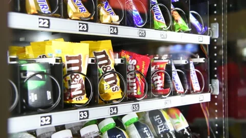 chocolate bars in snack vending machine | Stock Video | Pond5