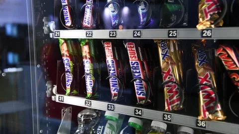 chocolate bars in snack vending machine | Stock Video | Pond5