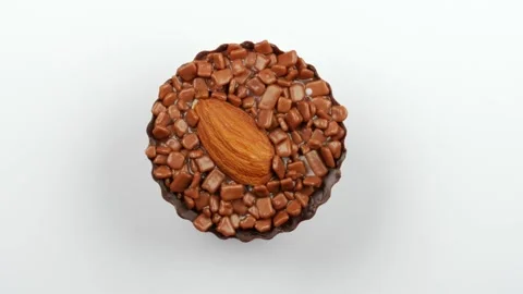 Chocolate candy with almonds rotates on ... | Stock Video | Pond5
