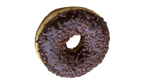 Chocolate donut spinning around 360 degr... | Stock Video | Pond5