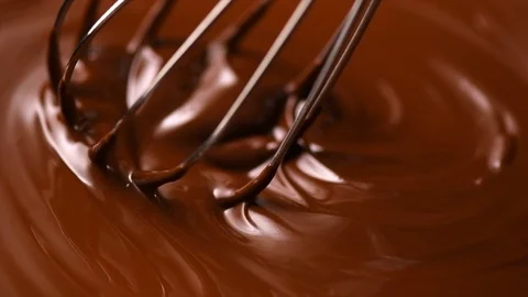Chocolate. Mixing melted dark chocolate ... | Stock Video | Pond5