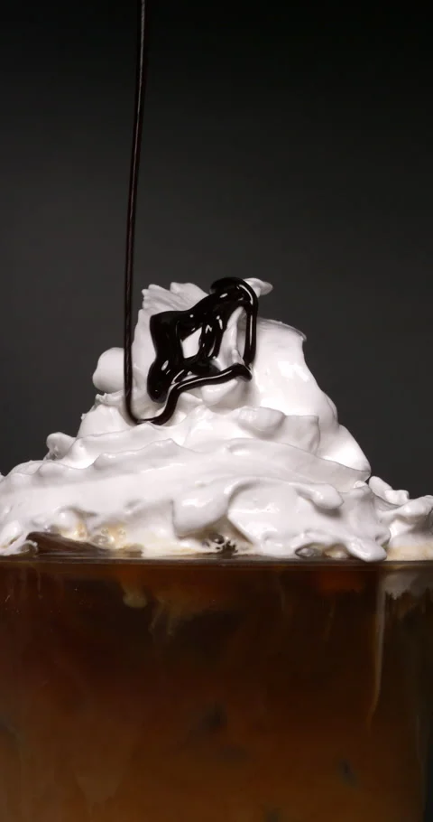 Chocolate rash on whipped cream on iced ... | Stock Video | Pond5