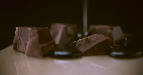 Chocolate syrup fall on milk chocolate p... | Stock Video | Pond5