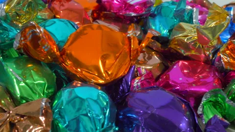 Chocolates / candy / sweets in bright, s... | Stock Video | Pond5