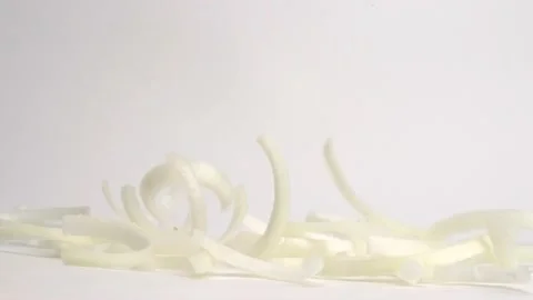 Chopped white onion pieces falling and b... | Stock Video | Pond5
