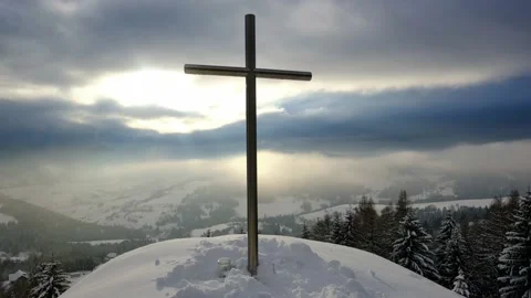 A Christian cross in a winter mountain l... | Stock Video | Pond5