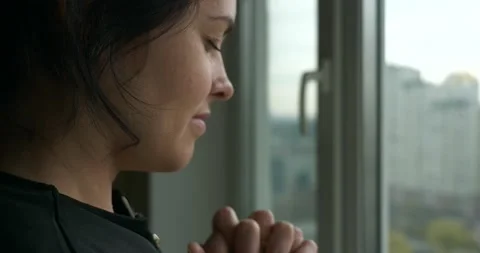 Christian Pretty Woman Praying near Wind... | Stock Video | Pond5