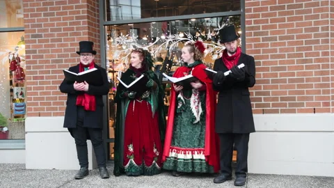 Christmas Caroling quartet in front of b... | Stock Video | Pond5