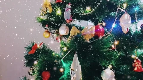 Christmas tree, falling snow and glitter... | Stock Video | Pond5