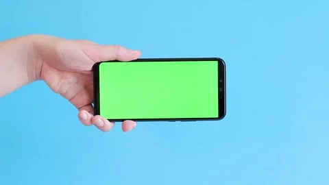 Chroma key mockup on smartphone in hand,... | Stock Video | Pond5