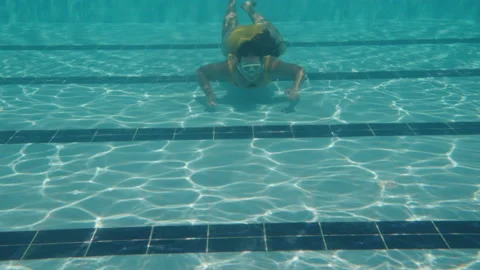 A chubby girl in a yellow swimsuit and a... | Stock Video | Pond5