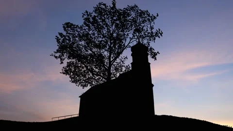 Church Building with Silhouette Tree san... | Stock Video | Pond5