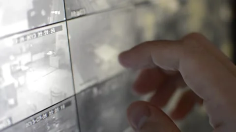 cia agent using cctv security monitor fo... | Stock Video | Pond5