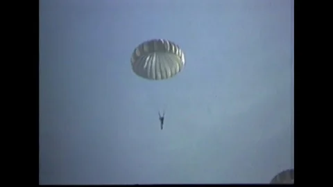 CIDG soldiers parachutes float down duri... | Stock Video | Pond5