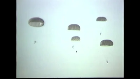 CIDG soldiers parachutes float down duri... | Stock Video | Pond5