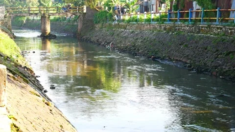 CIJAWURA RIVER WATER FLOW FROM THE FRONT | Stock Video | Pond5